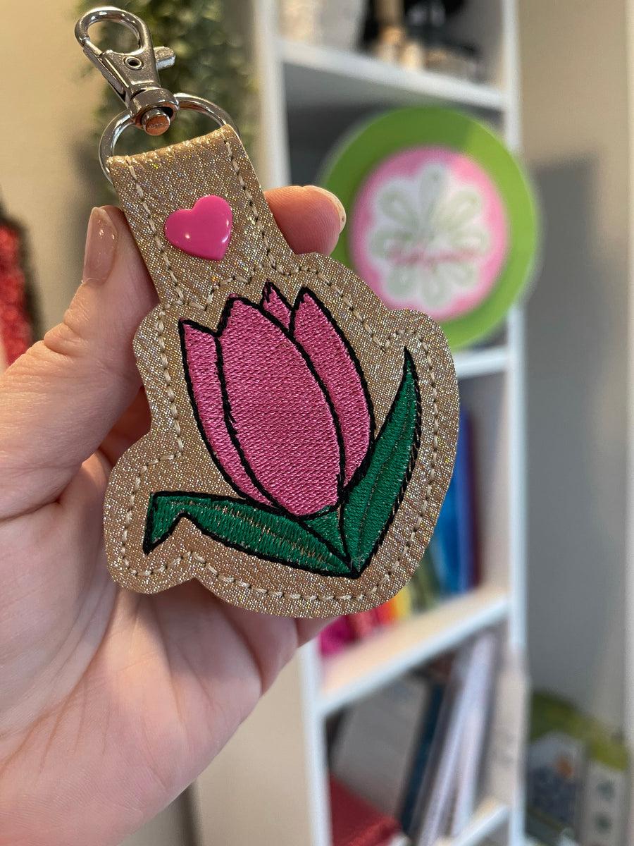 Tulip snap tab embroidery design – Designs By Babymoon