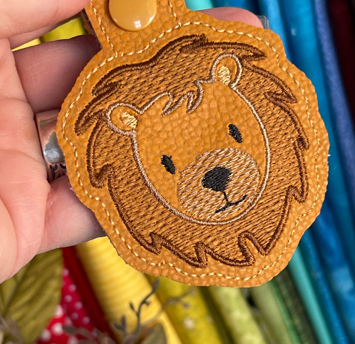 Lion Face snap tab embroidery design – Designs By Babymoon