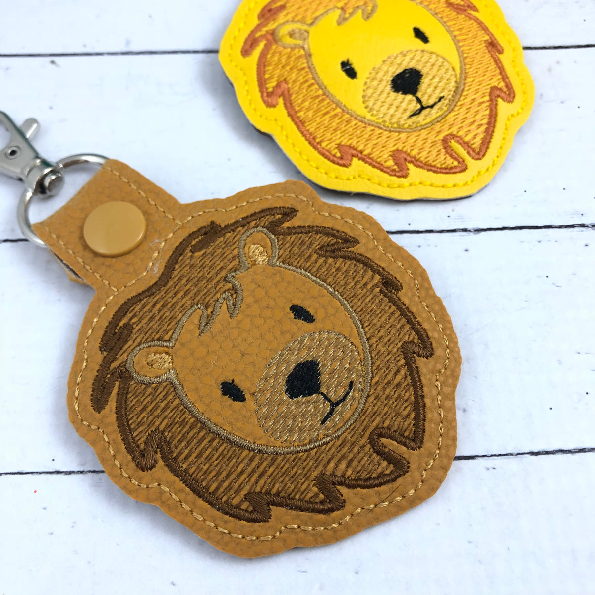 Lion Face snap tab embroidery design – Designs By Babymoon